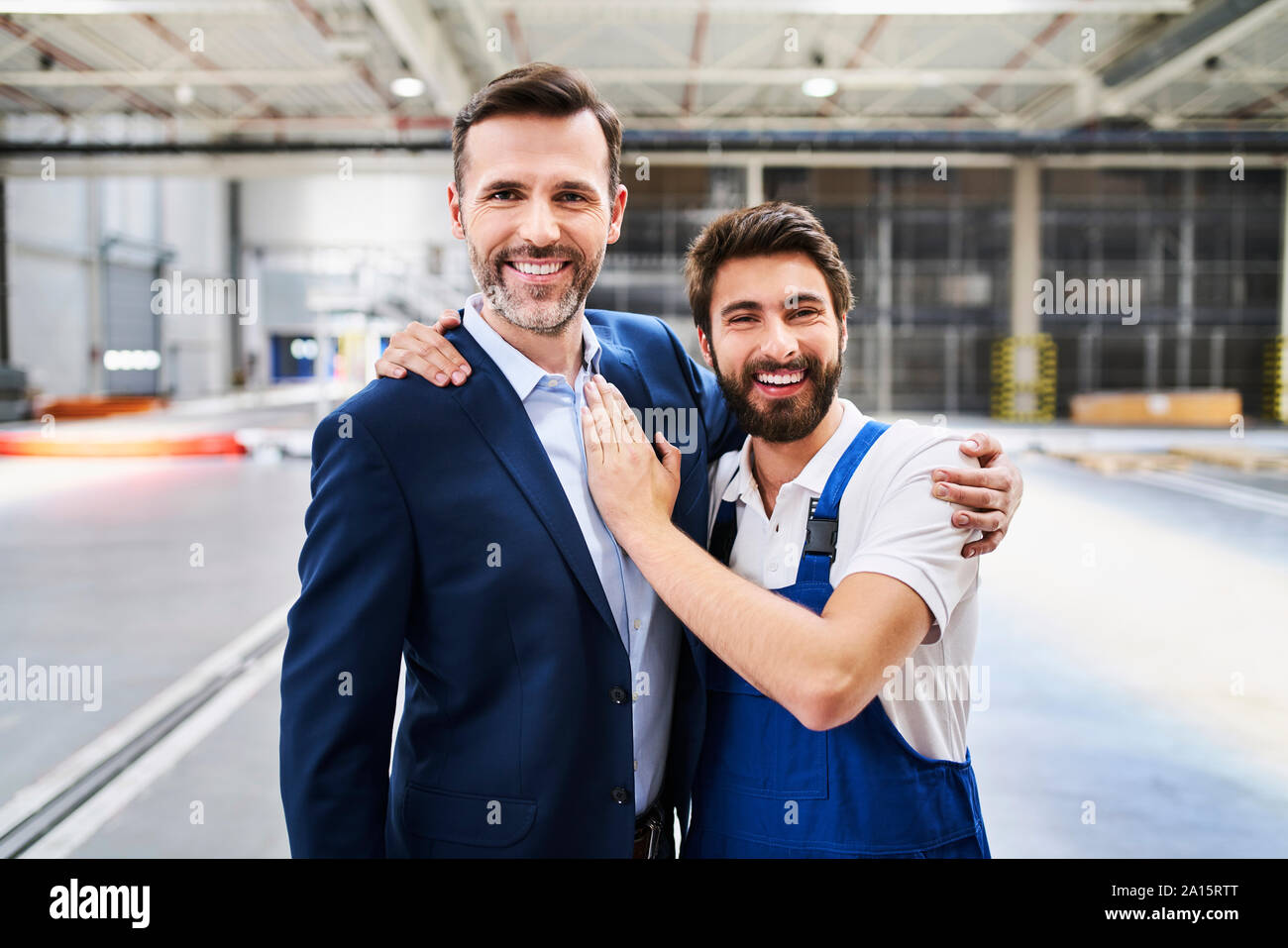 Happy men in factory hi-res stock photography and images - Alamy
