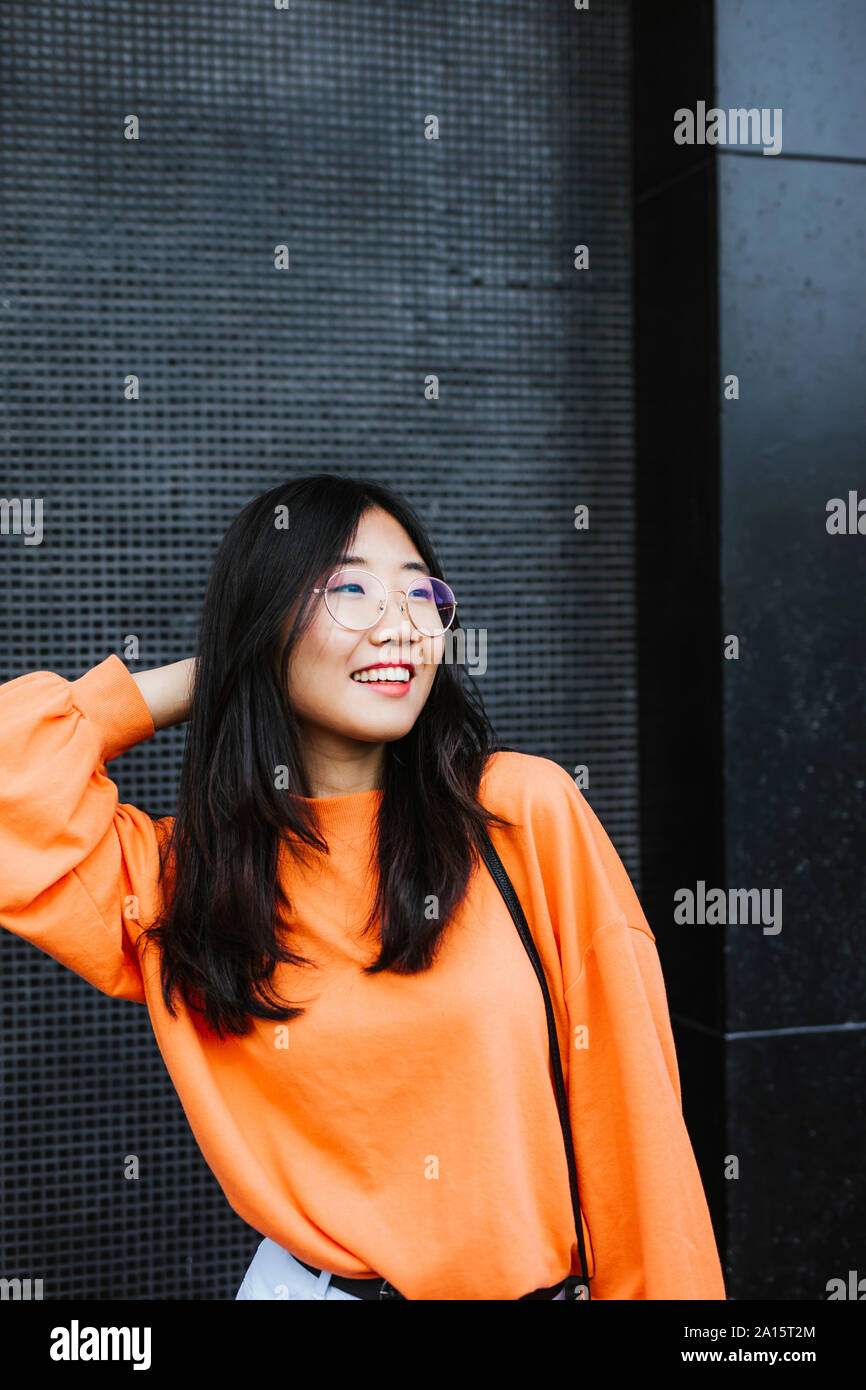 Portrait of smiling asian woman looking sideways Stock Photo - Alamy