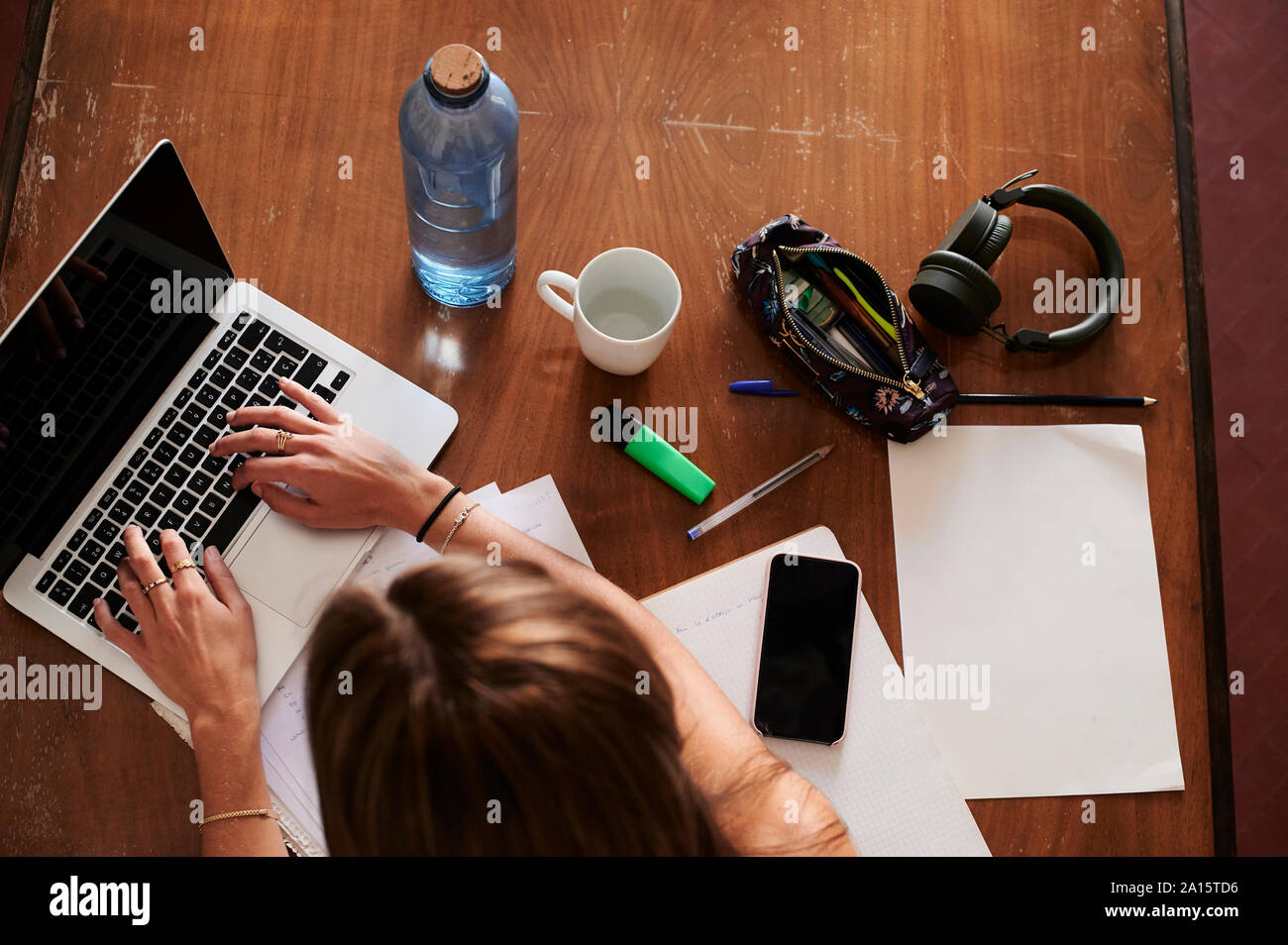 Female student studying at home, using laptop Stock Photo - Alamy