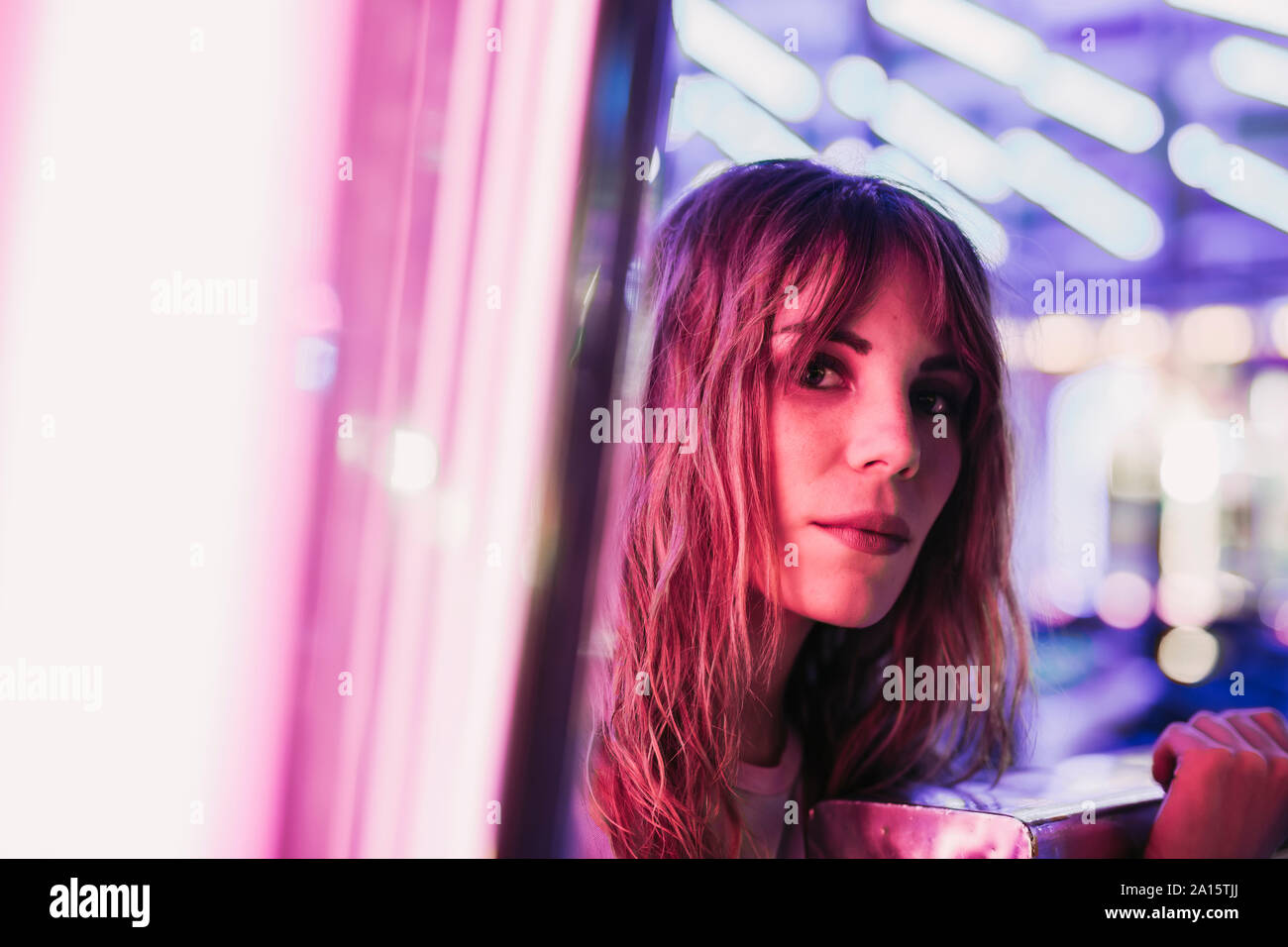 Portrait of a young woman on a funfair at night Stock Photo - Alamy