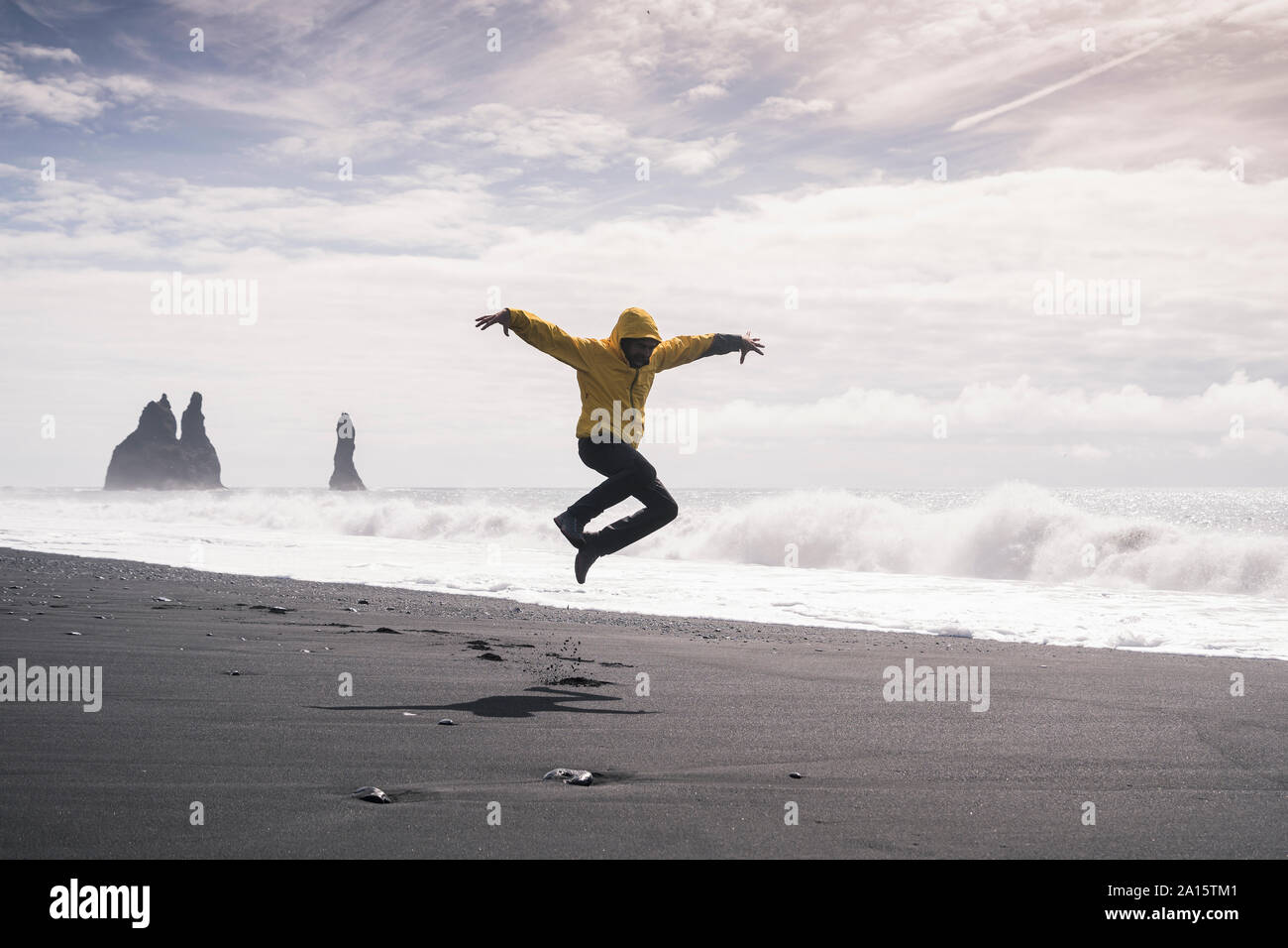 Man jumping on the beach hi-res stock photography and images - Alamy