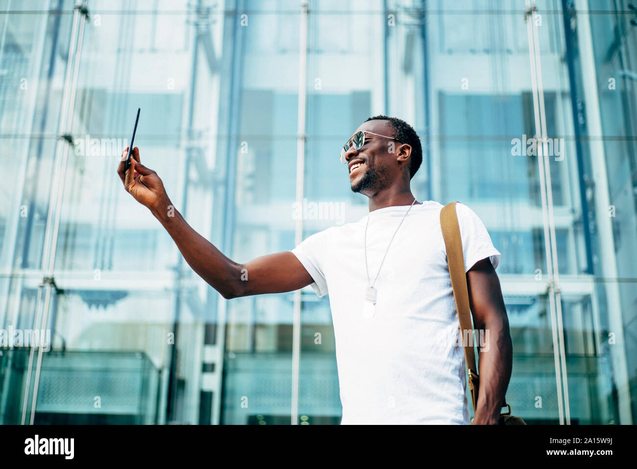 Young man sunglasses checking hi-res stock photography and images - Alamy
