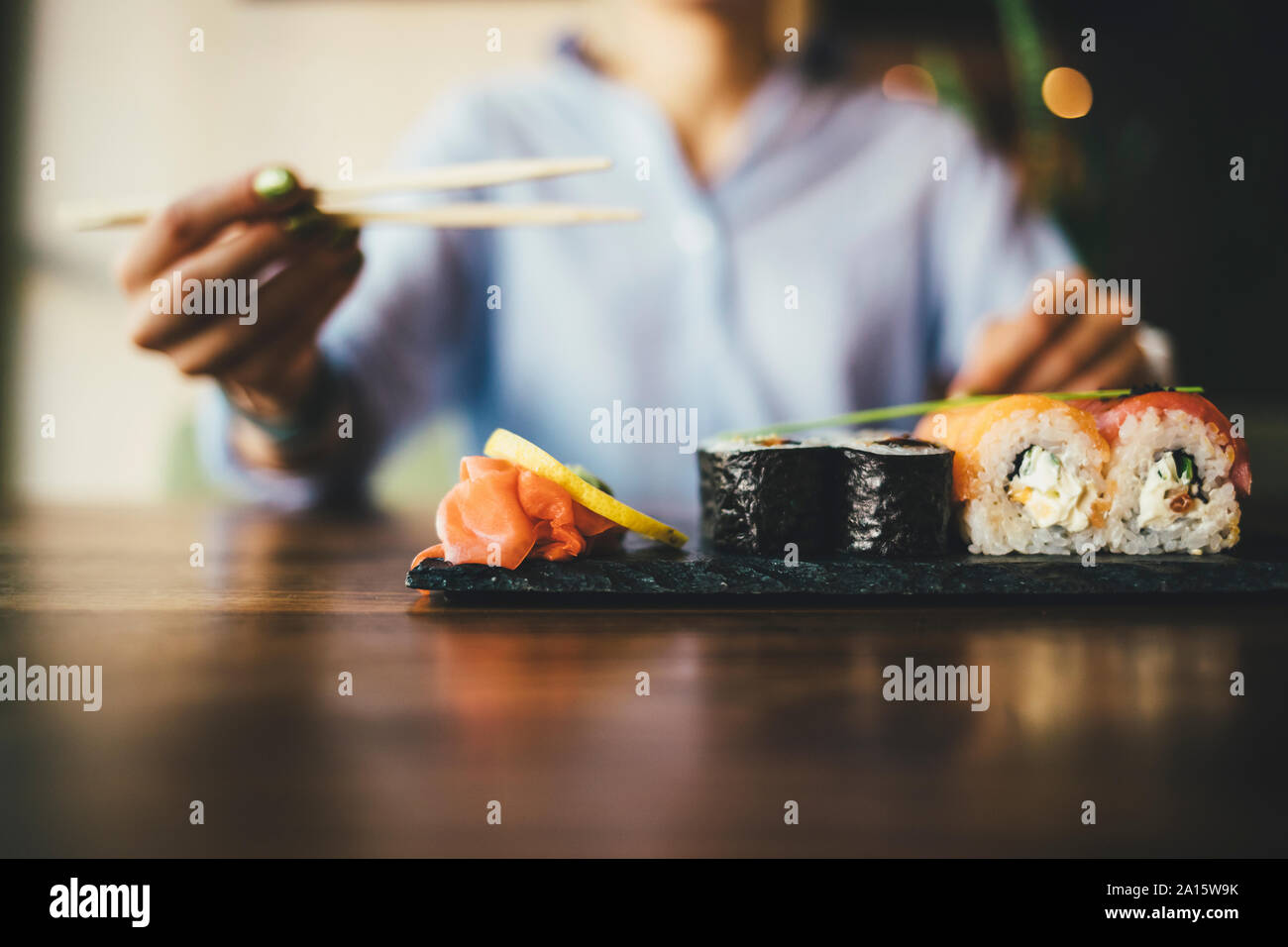 Japanese person eating sushi hi-res stock photography and images - Alamy