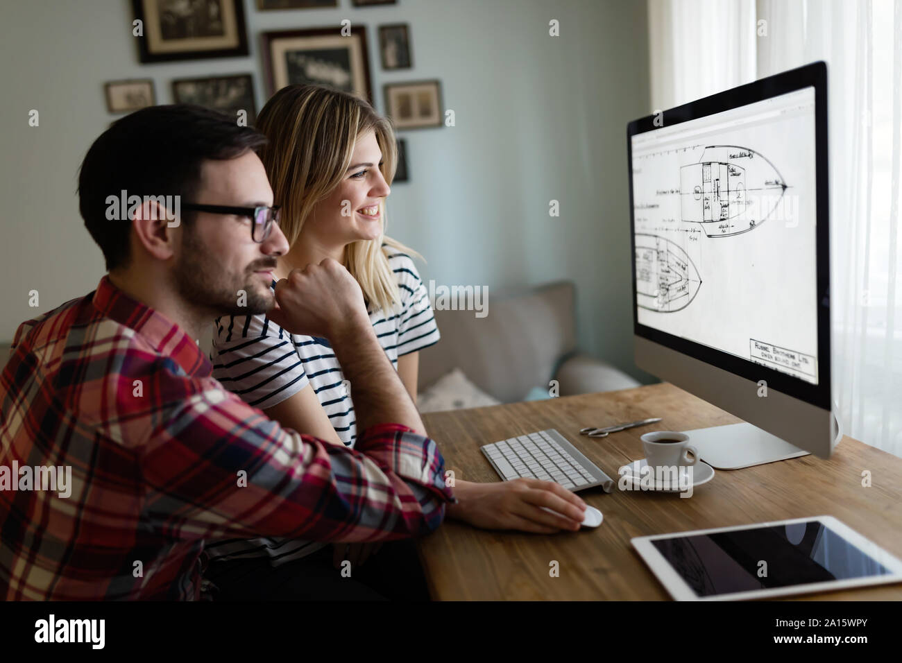 Young attractive designers working together from home Stock Photo - Alamy