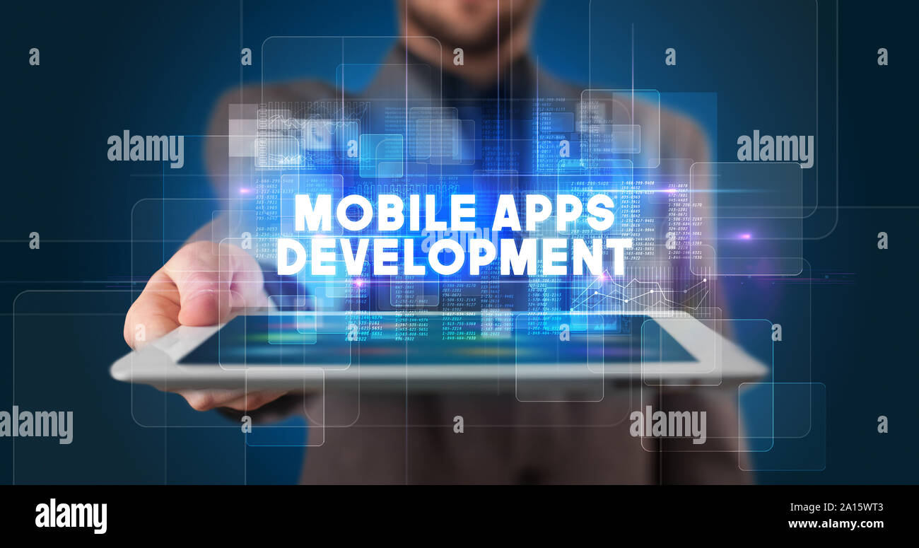 Young business person working on tablet and shows the inscription ...