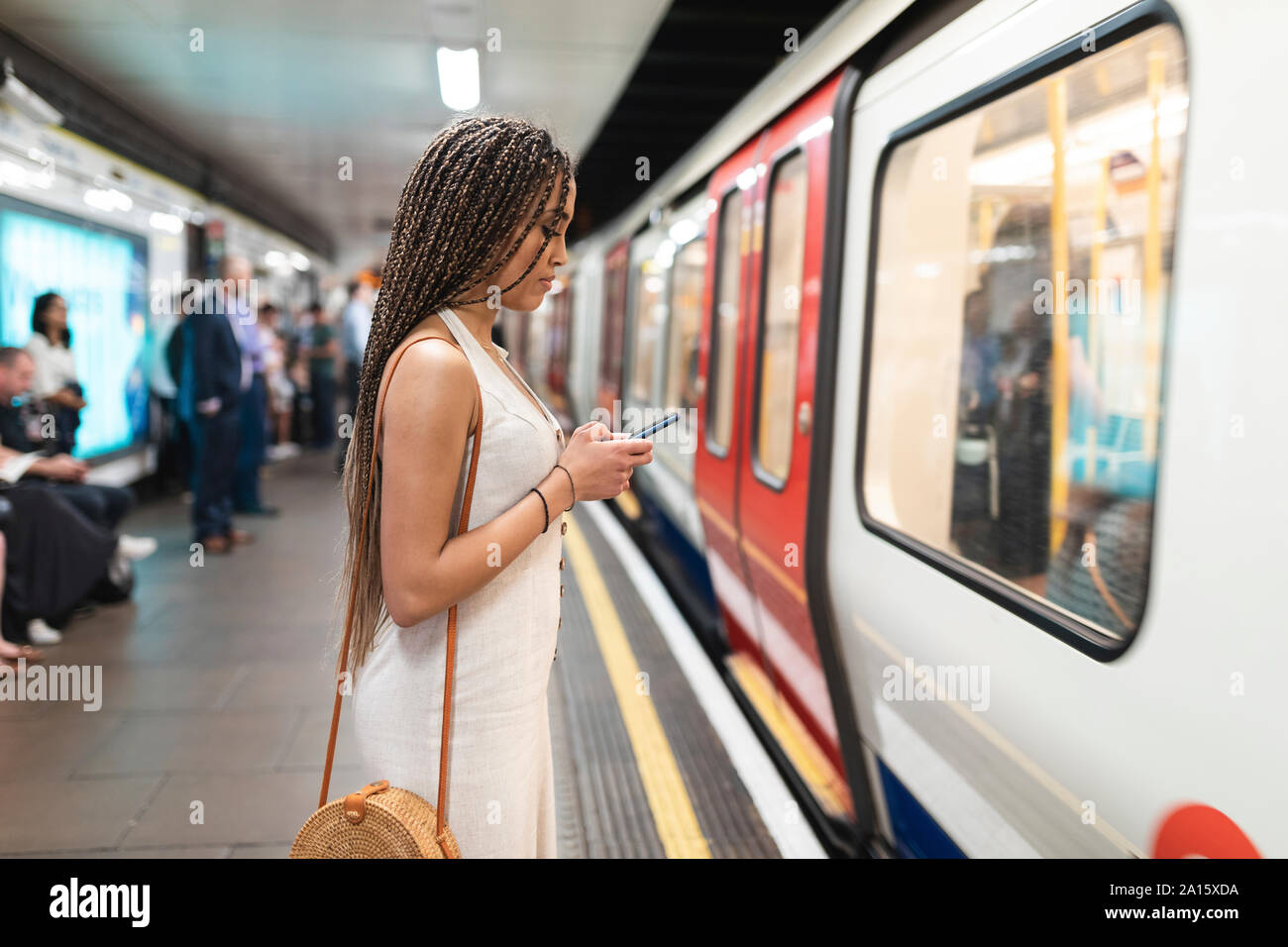 Woman waiting for subway hi-res stock photography and images - Alamy