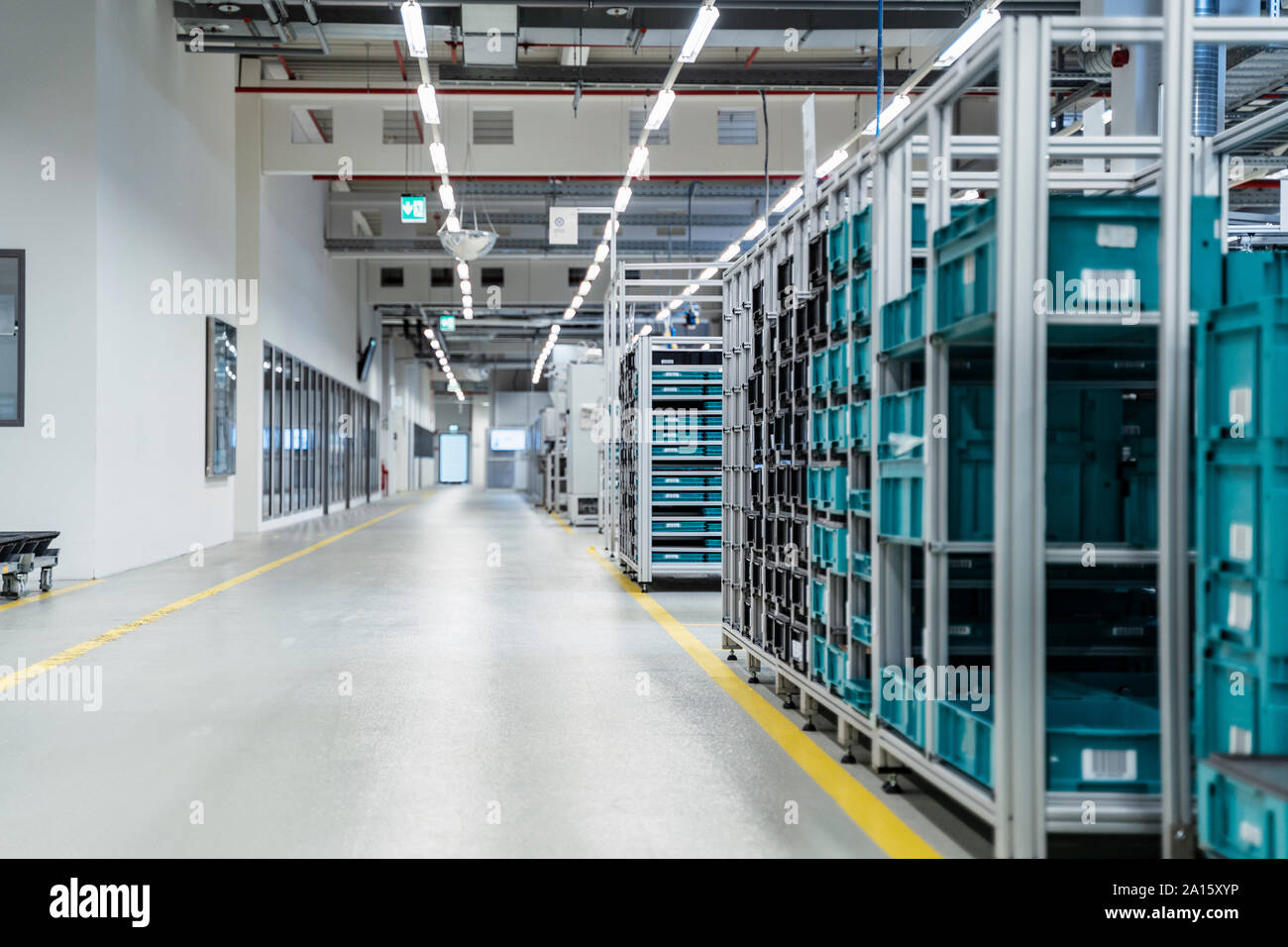 Stacked containers inside modern factory warehouse hi-res stock ...