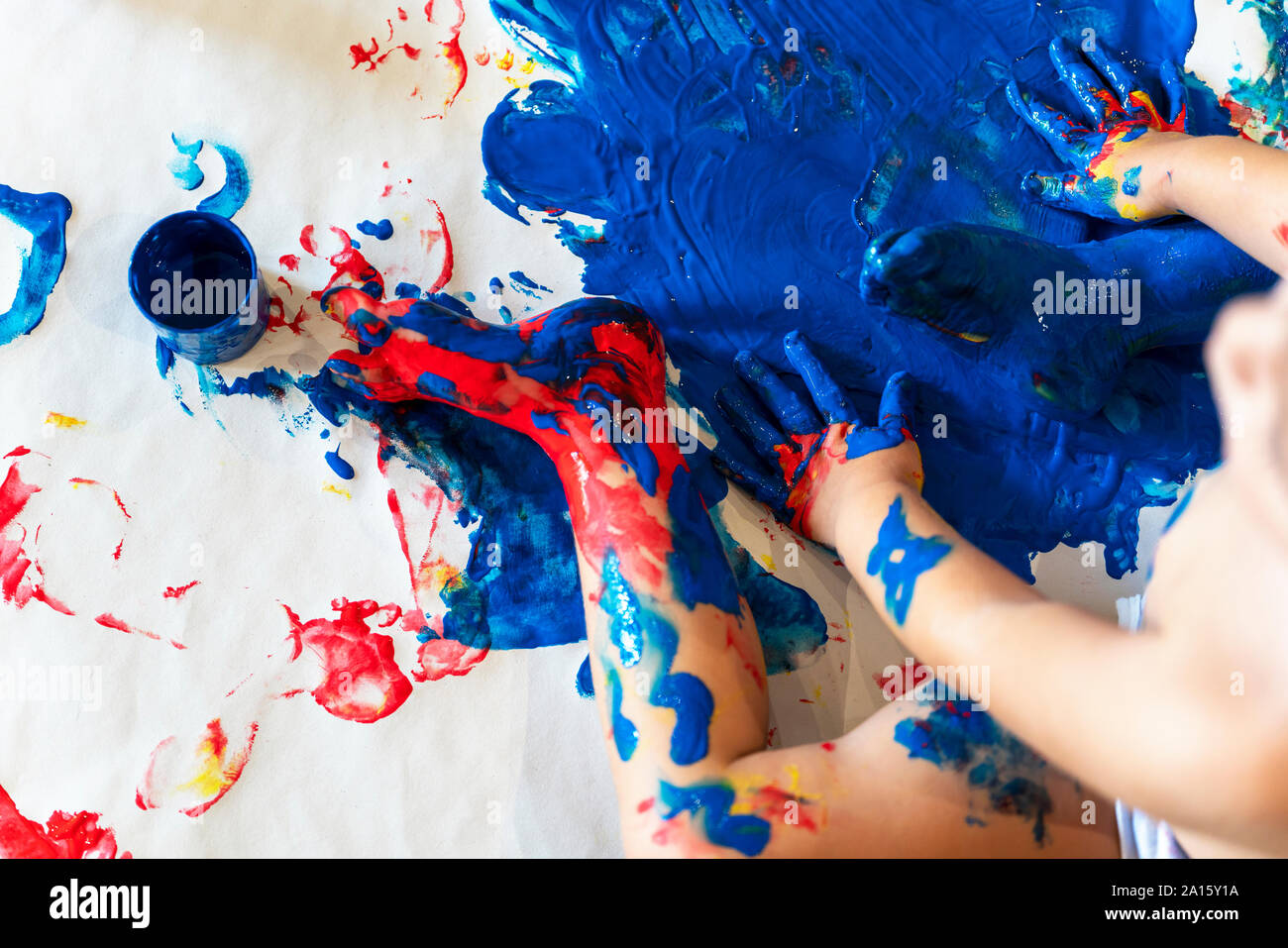 Child pot blue paint hi-res stock photography and images - Alamy