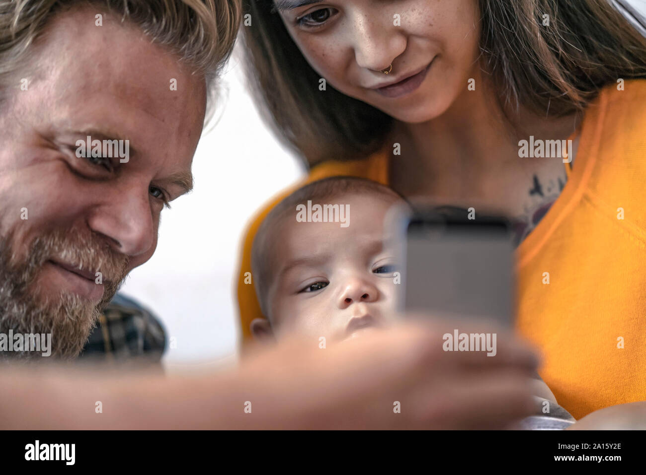Group boys using mobile phone hi-res stock photography and images - Alamy