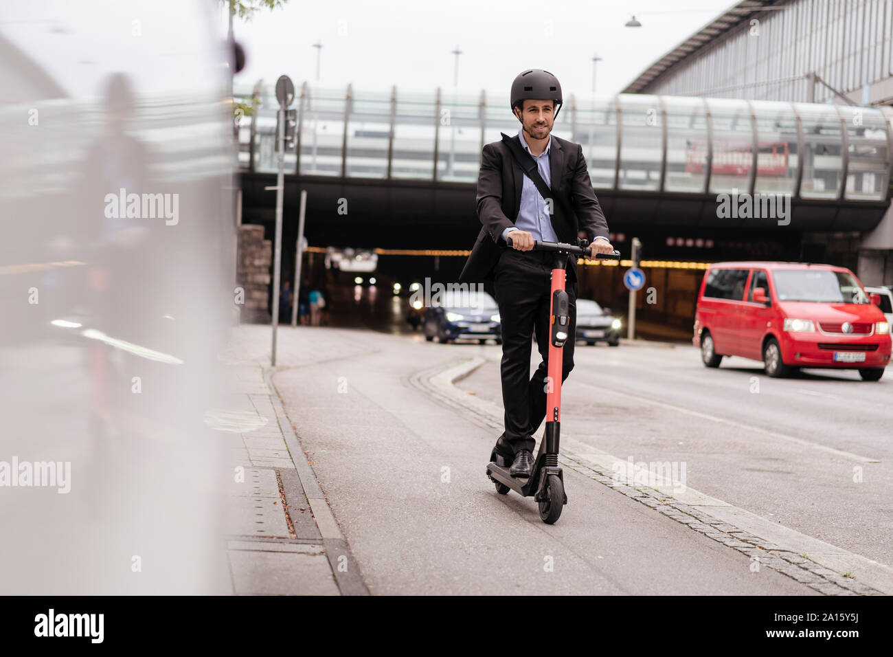 Adult riding scooter on pavement hi-res stock photography and images ...