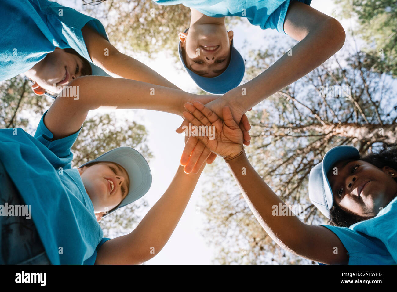 Group of kids stacking hands Stock Photo - Alamy