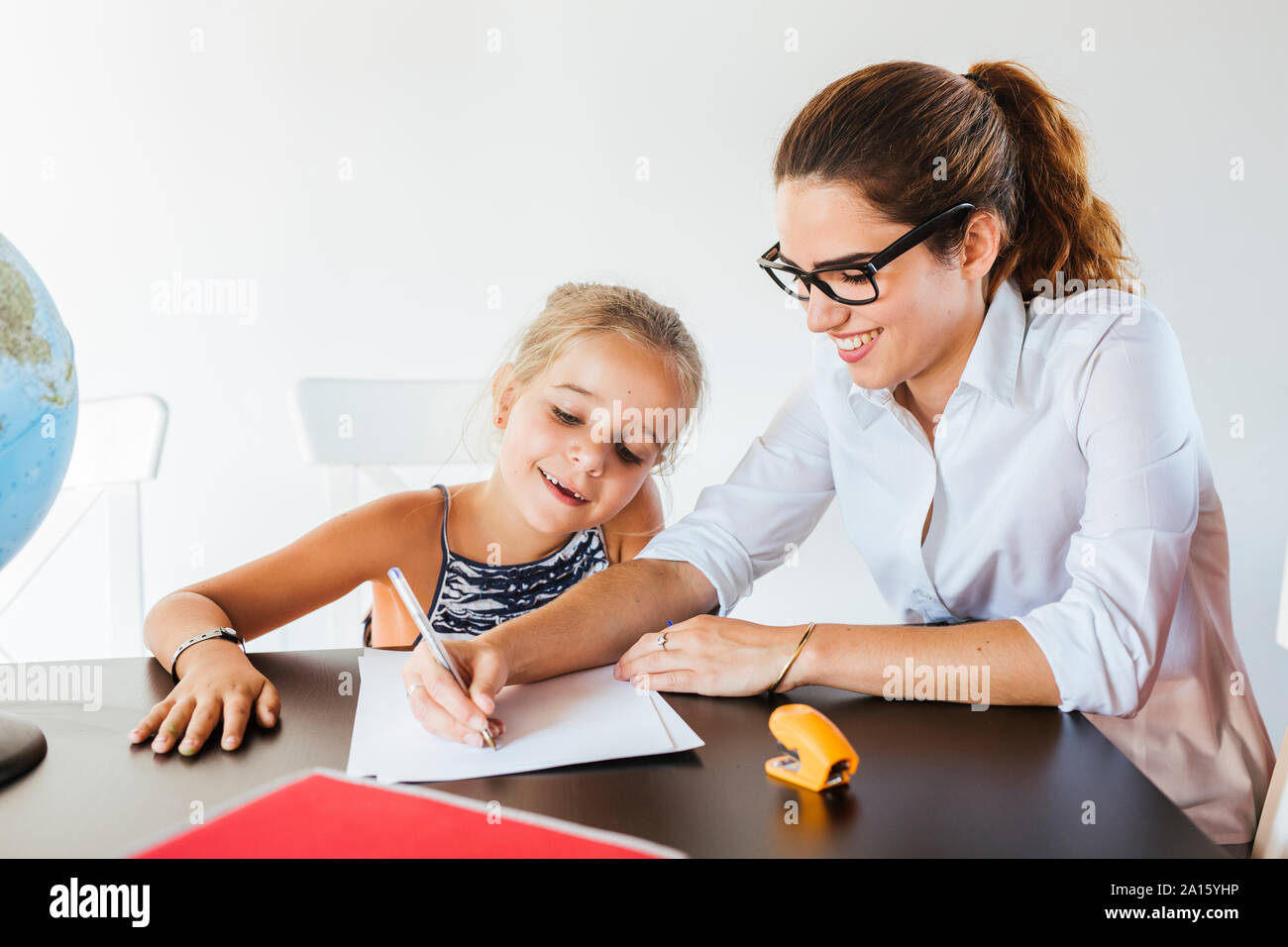Schoolgirl with teacher hi-res stock photography and images - Alamy