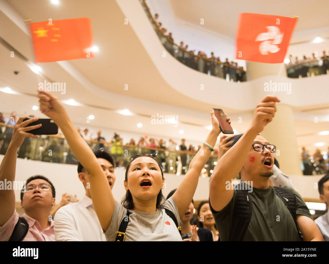 Hong Kong, China. 24th Sep, 2019. People attend a patriotic flash mob ...