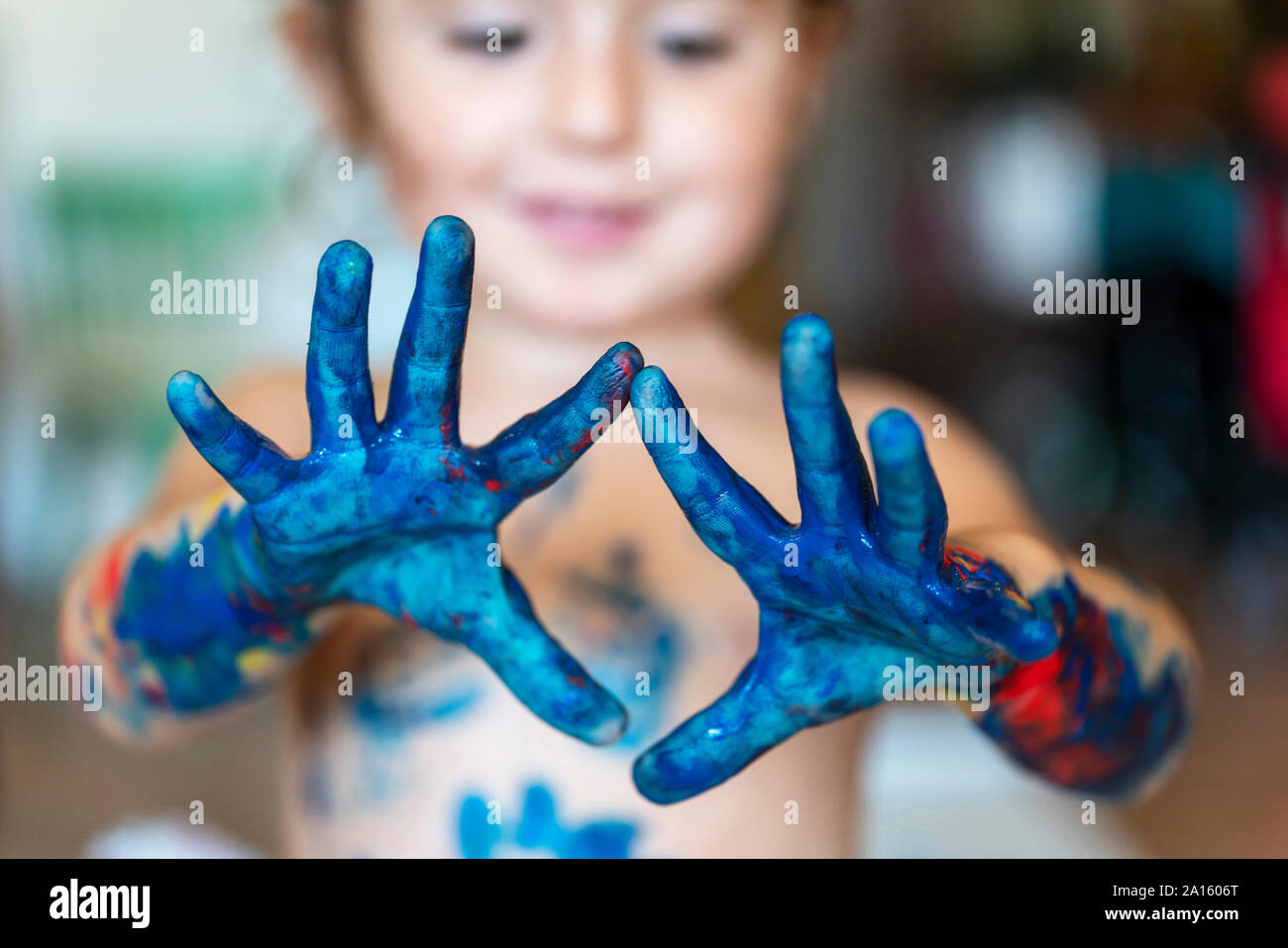 Little girl's blue painted hands, close-up Stock Photo - Alamy