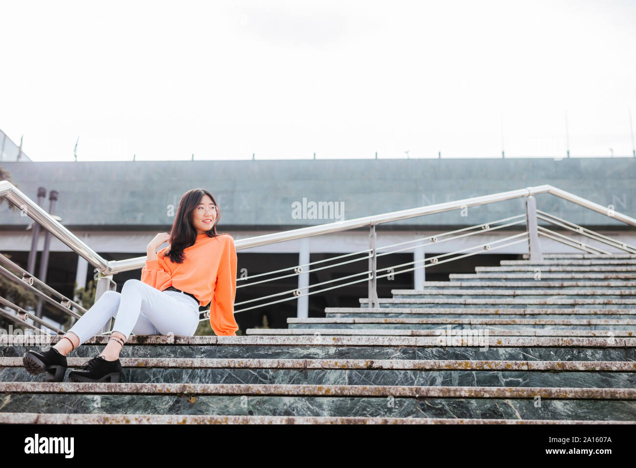 Asian woman sitting hi-res stock photography and images - Alamy