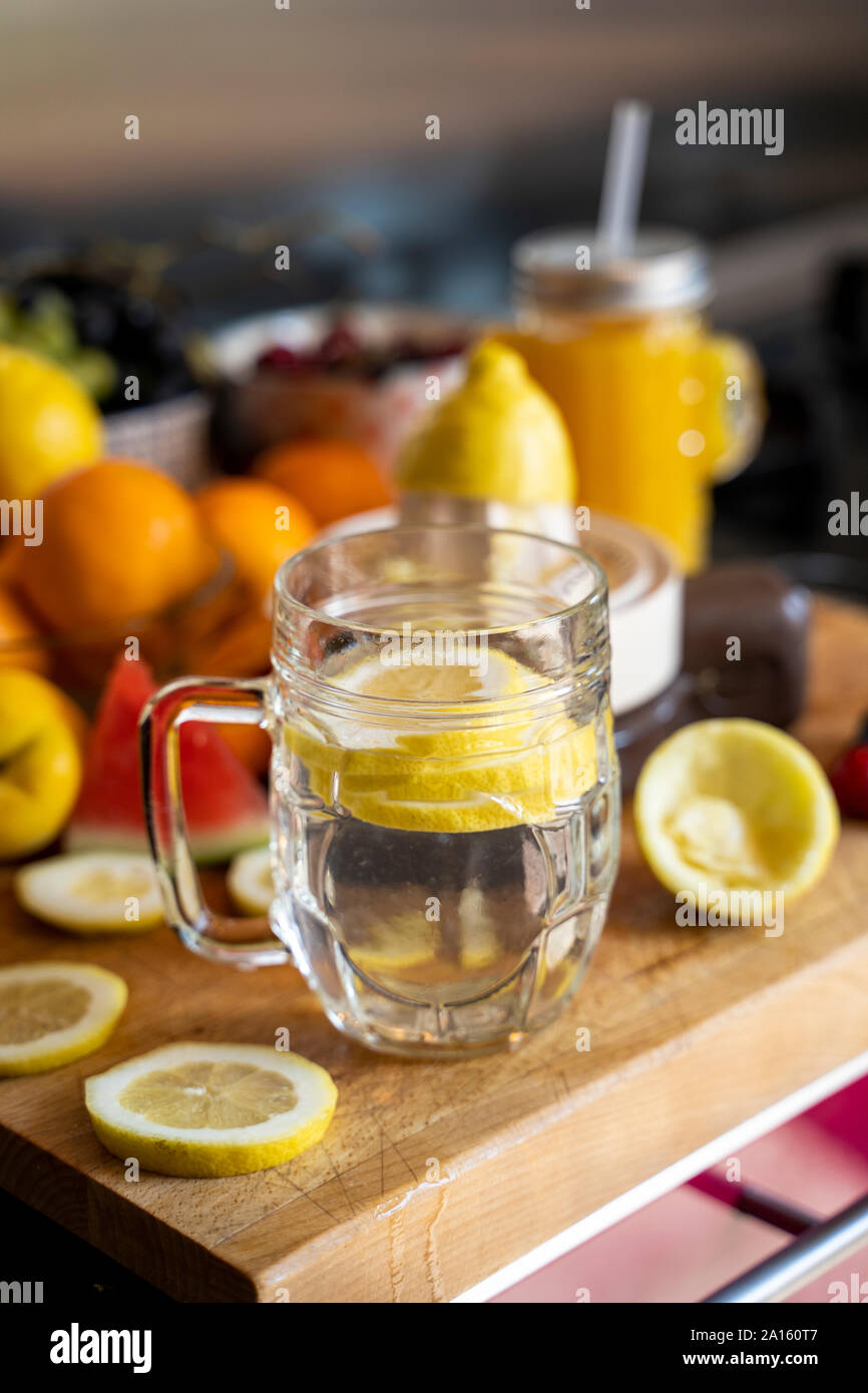 Lemon infusion on kitchen table with various fruit Stock Photo - Alamy