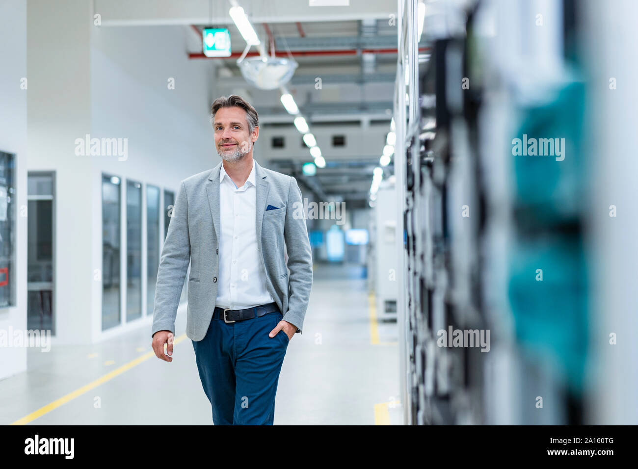 Businessman walking factory workshop hi-res stock photography and ...