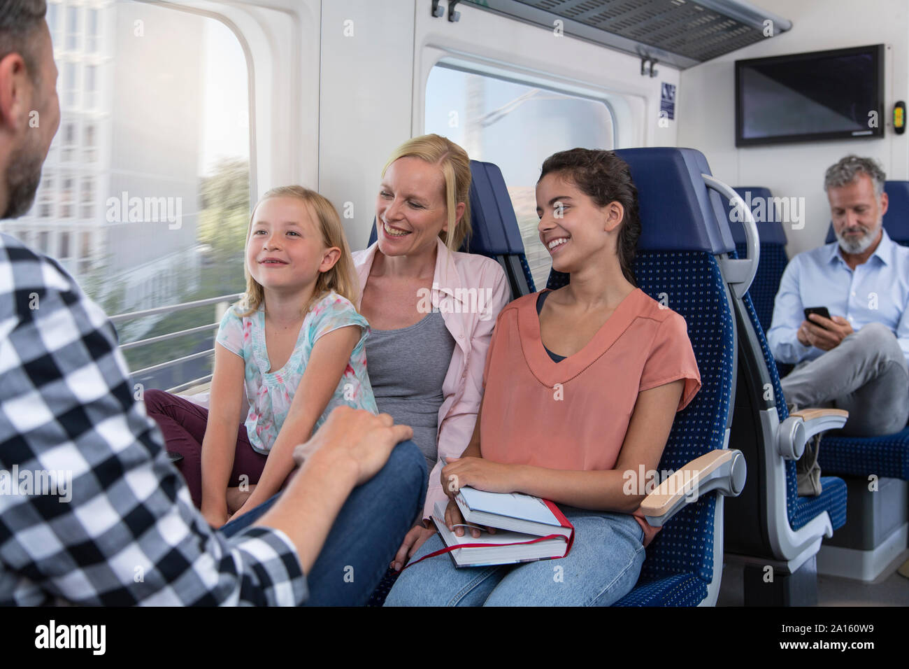 Family on a train hi-res stock photography and images - Alamy