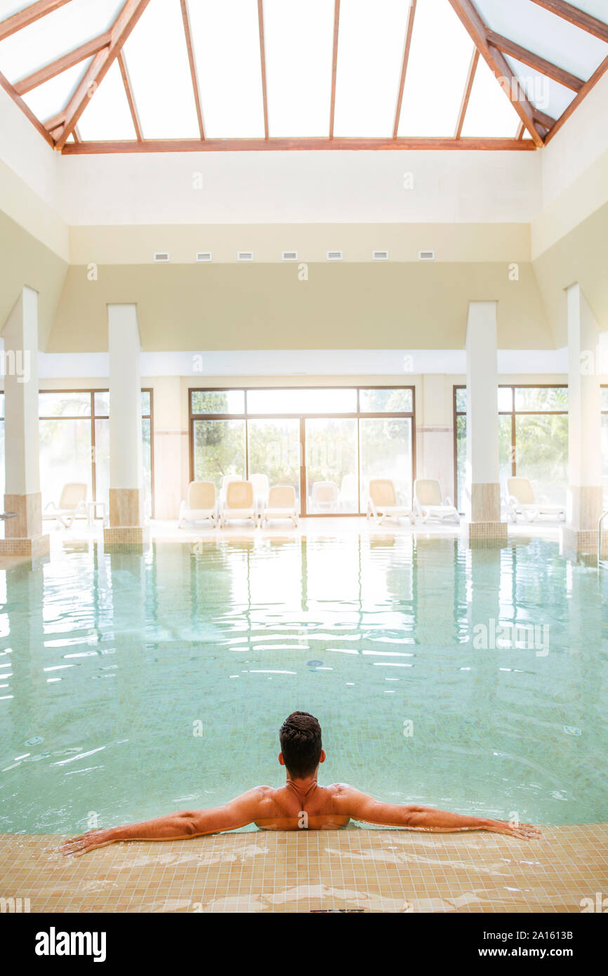 Man relaxing in swimming pool of a spa Stock Photo - Alamy