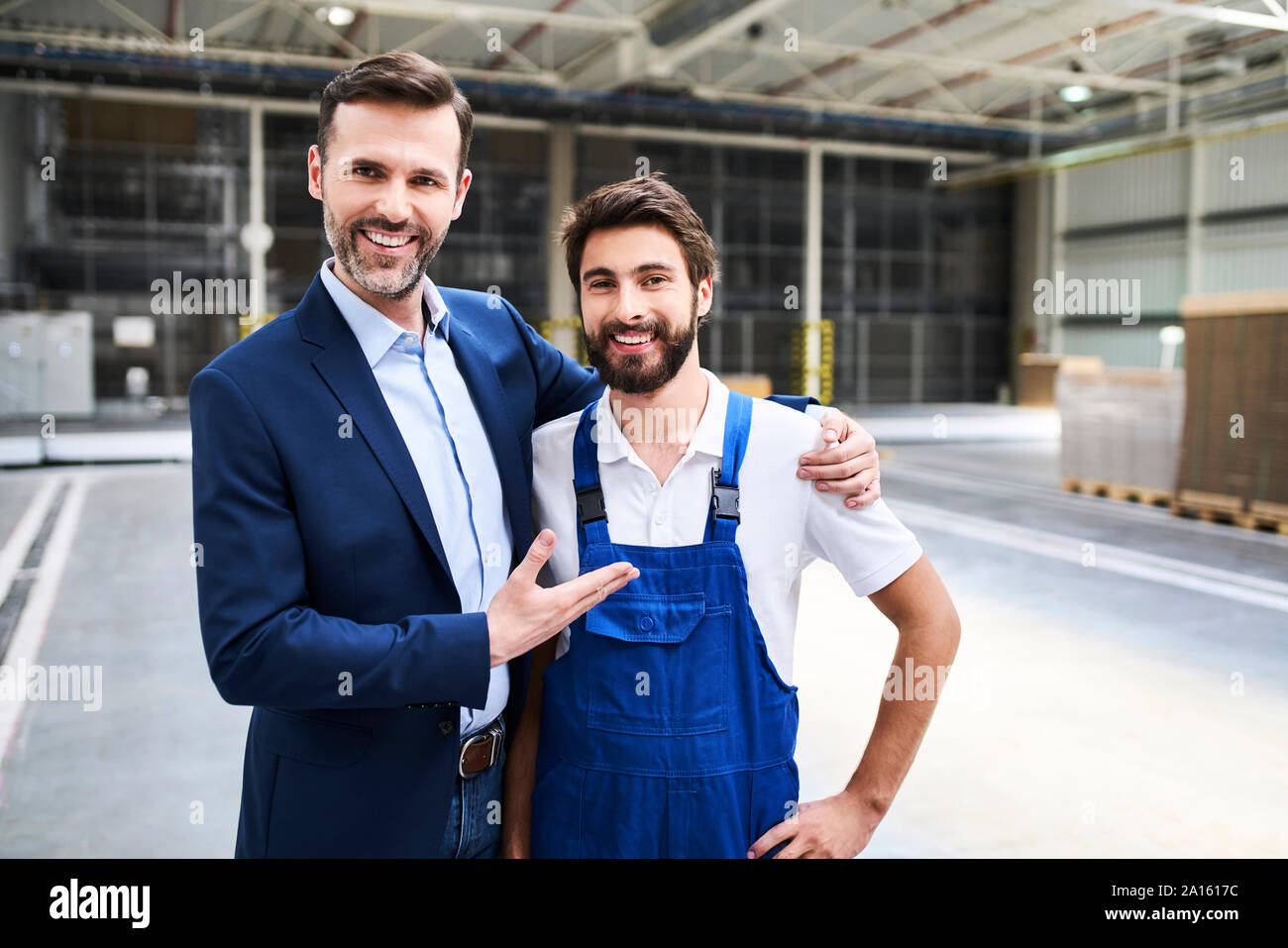 Happy men in factory hi-res stock photography and images - Alamy