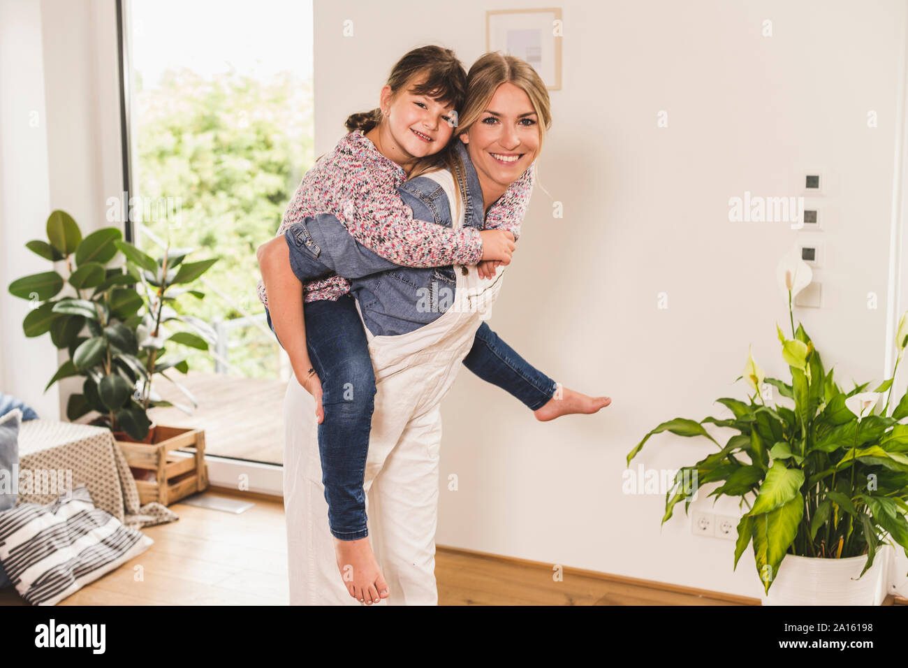 Mother piggyback floor hi-res stock photography and images - Alamy
