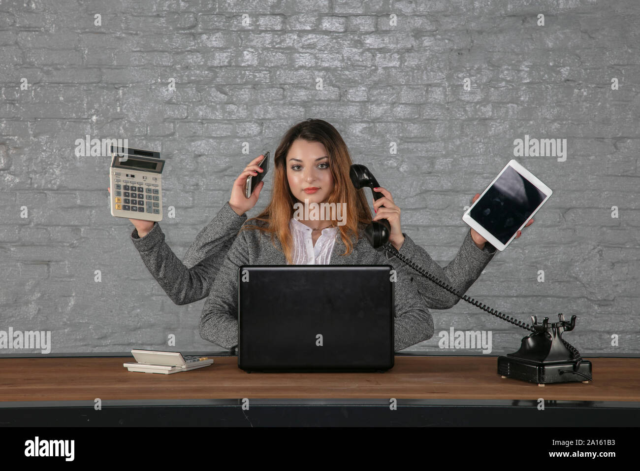 Multitasking woman working office desk hi-res stock photography and ...