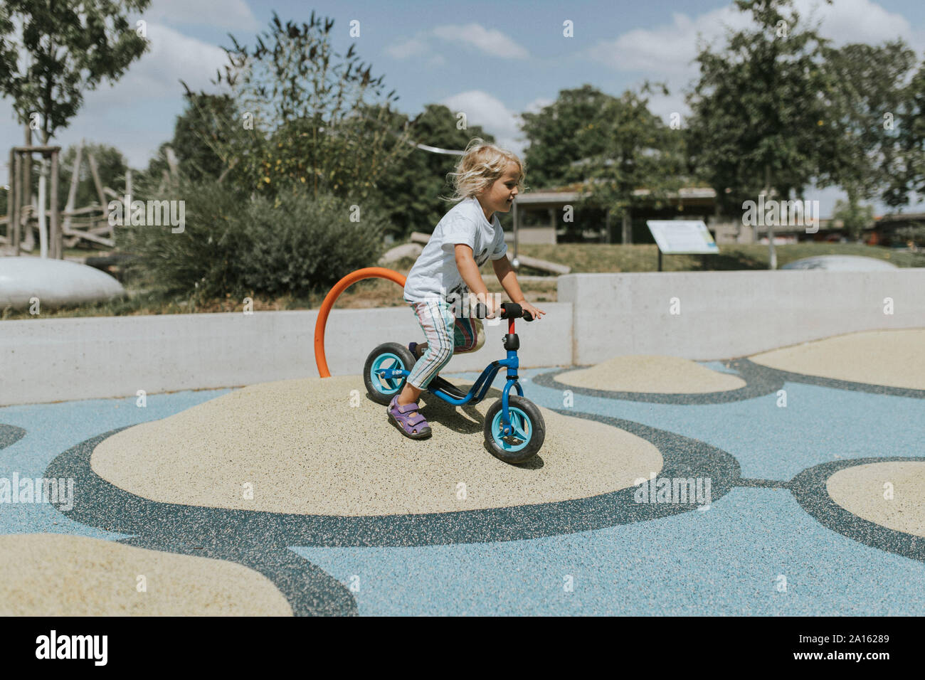 Cute girl playing riding scooter hi-res stock photography and images ...