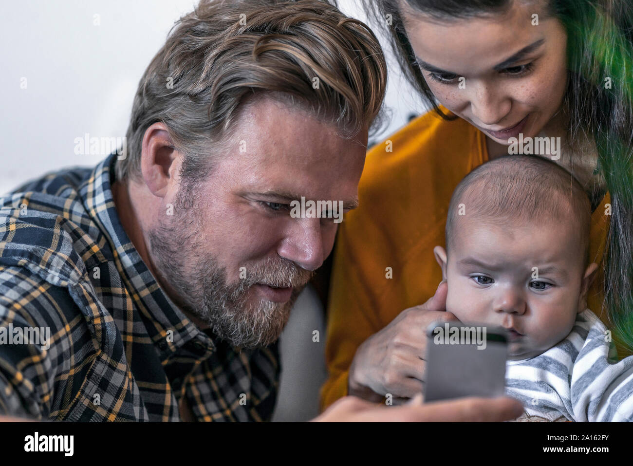 Mixed family phone hi-res stock photography and images - Alamy