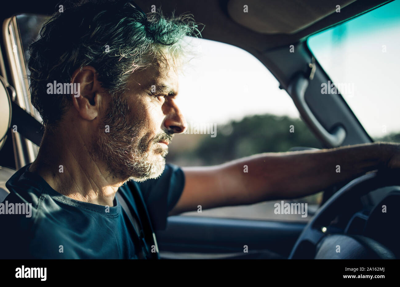 Squinting driving hi-res stock photography and images - Alamy