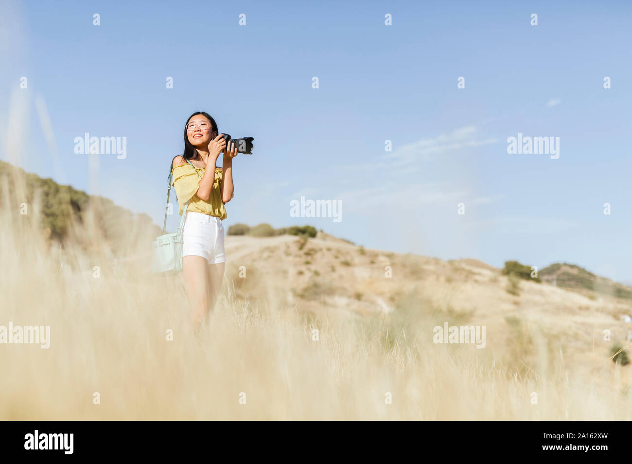 Young woman taking pictures in remote landscape, Granada, Spain Stock ...