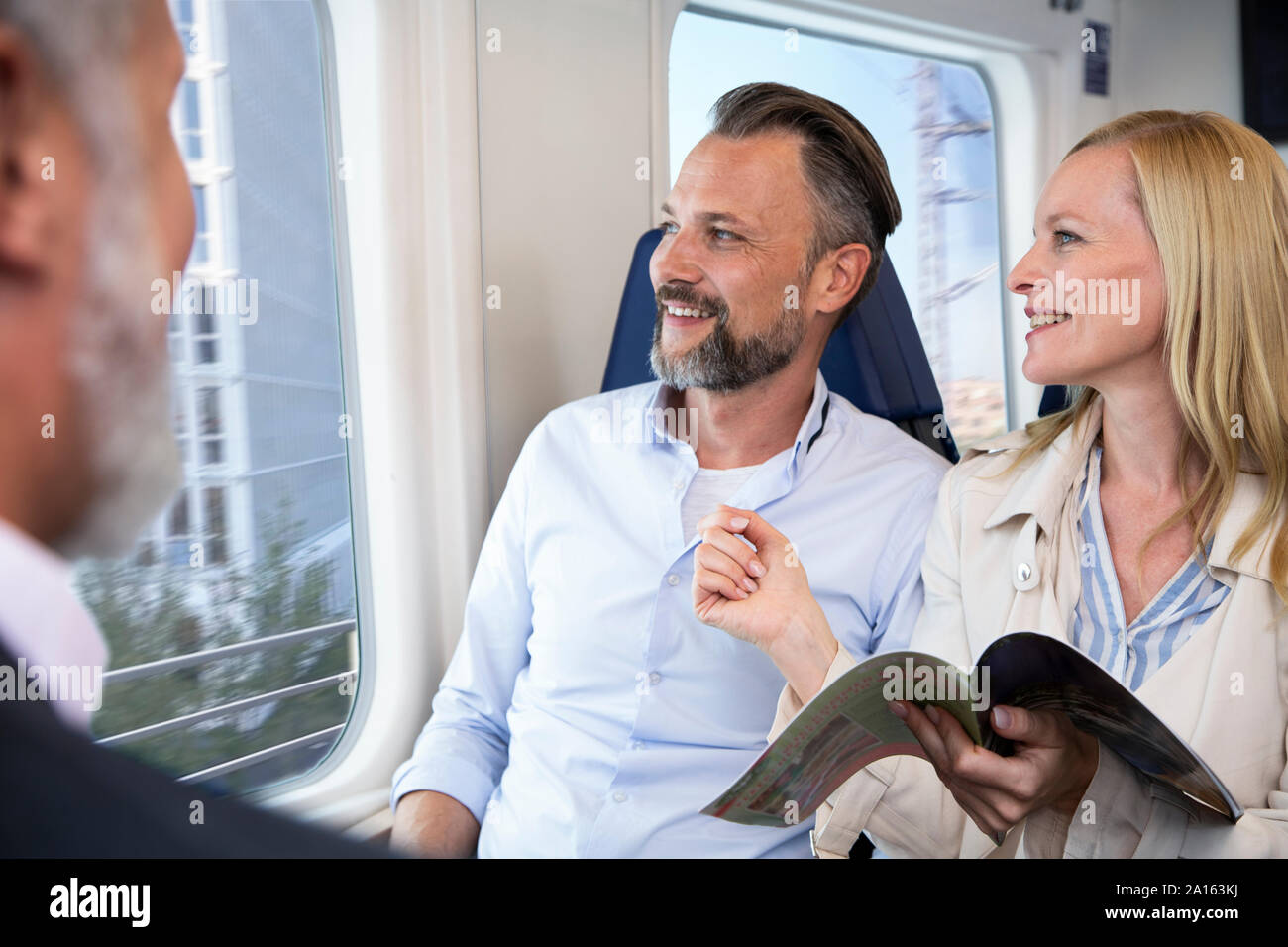 Couple sitting train hi-res stock photography and images - Alamy