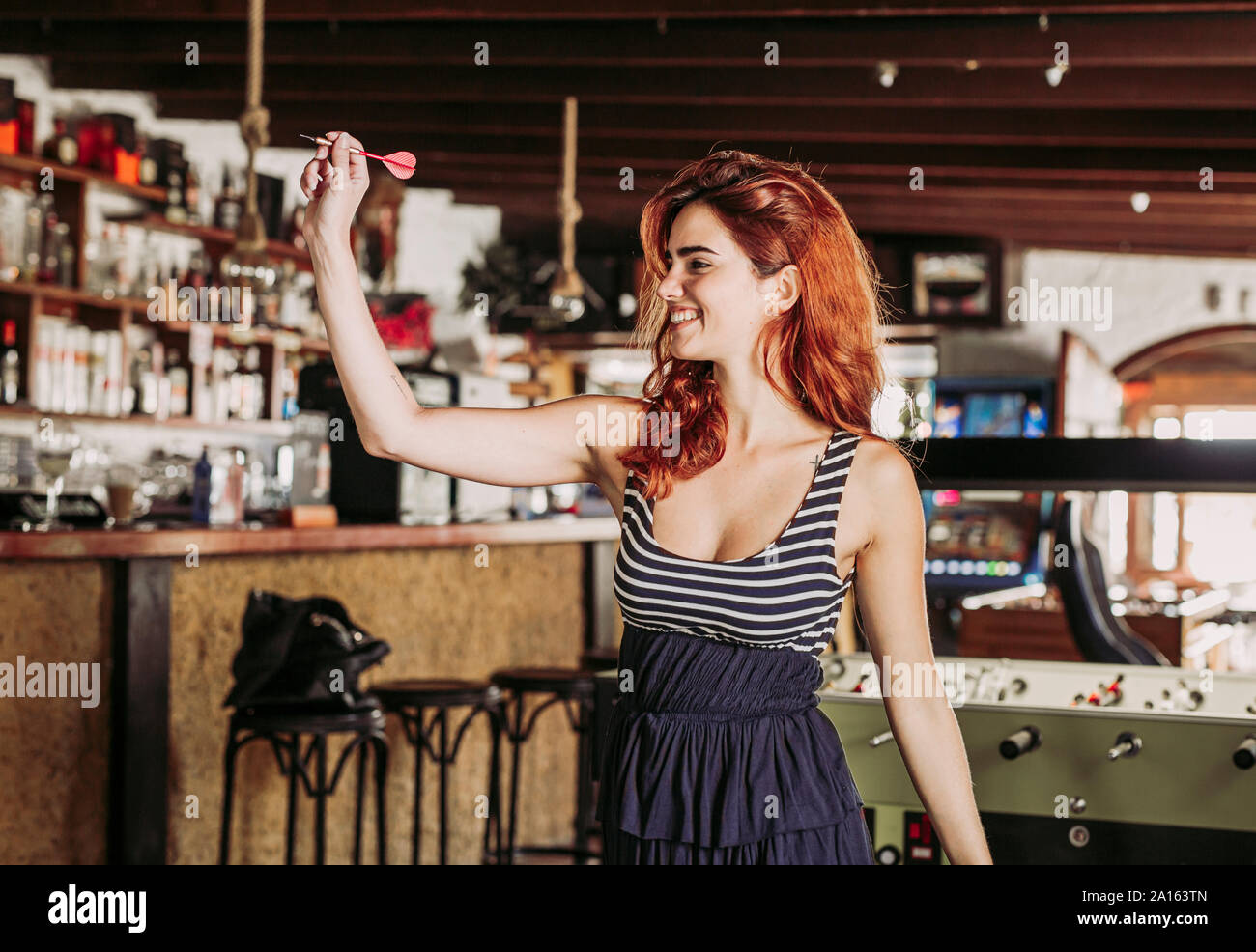Woman playing darts hi-res stock photography and images - Alamy