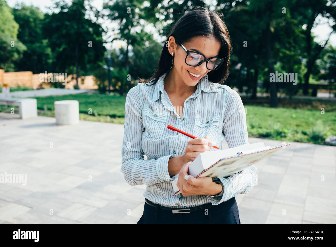 Note taking outdoors hi-res stock photography and images - Alamy
