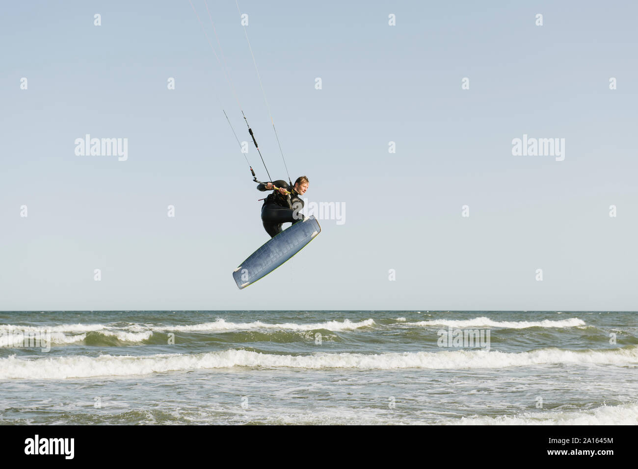 Kiteboarder jumping on the waves Stock Photo - Alamy