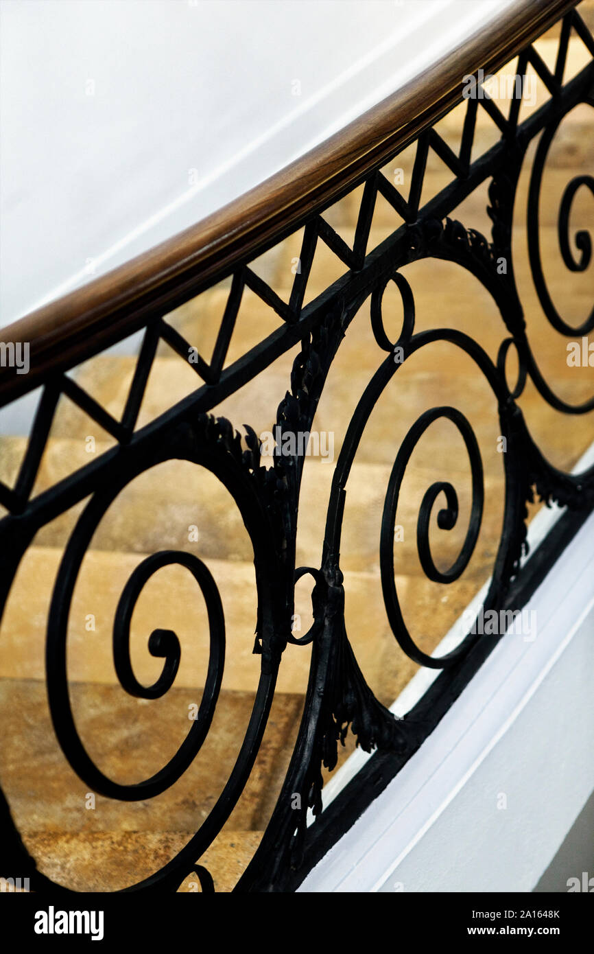 Stylish wrought iron handrail inside a French mansion Stock Photo - Alamy