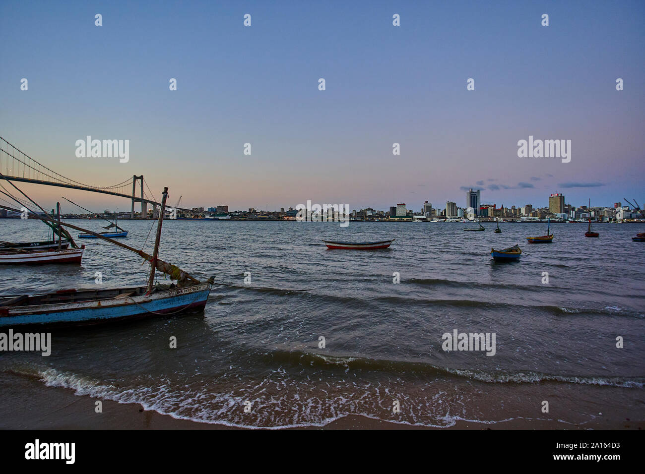 Small boats with view to the skyline of Maputo, Catembe, Mozambique ...