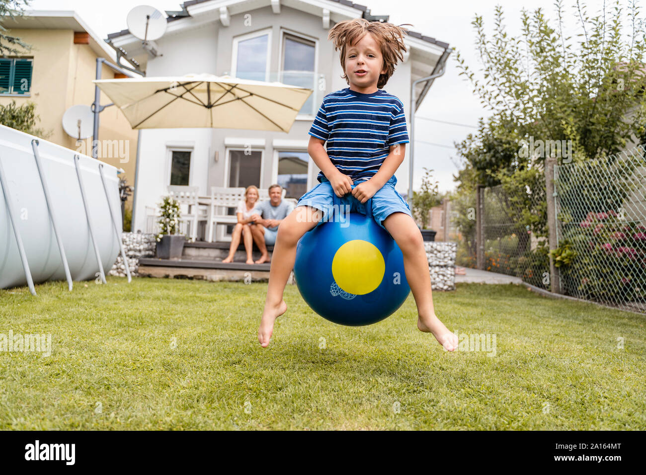Boy bouncing ball hi-res stock photography and images - Alamy