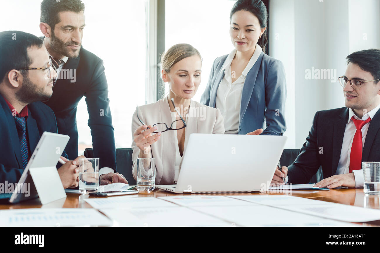 Team leader and her team of diverse people working on a business ...