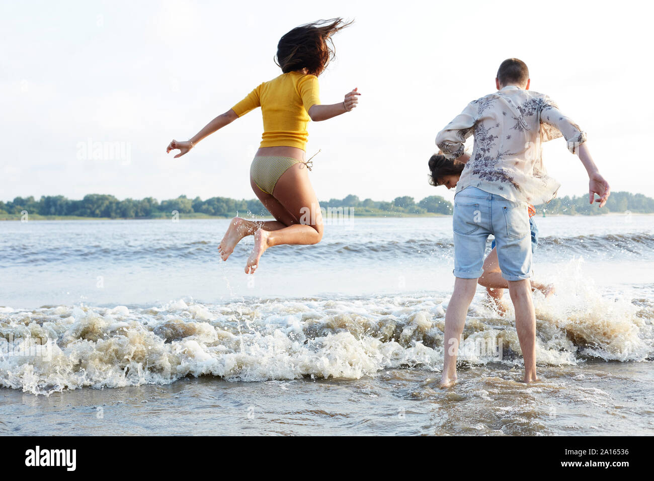 Friends jumping into river hi-res stock photography and images - Alamy
