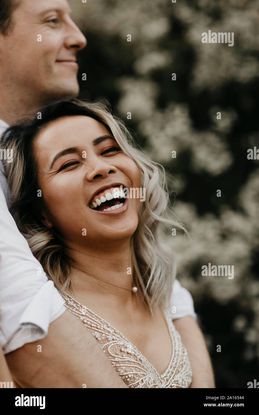 Portrait of laughing bride and groom outdoors Stock Photo - Alamy