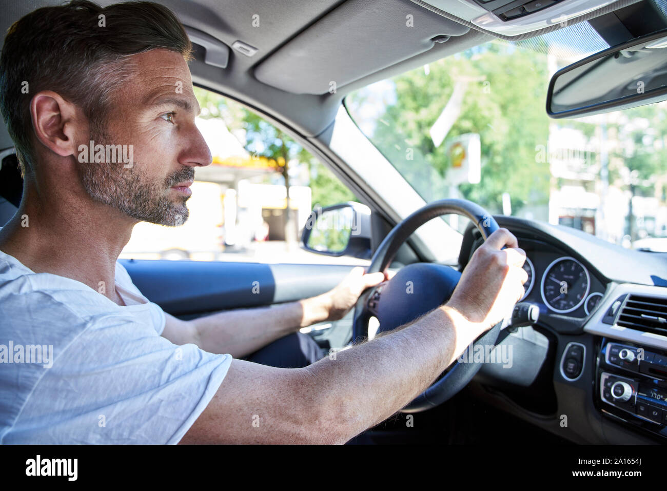 Mature man driving car Stock Photo - Alamy