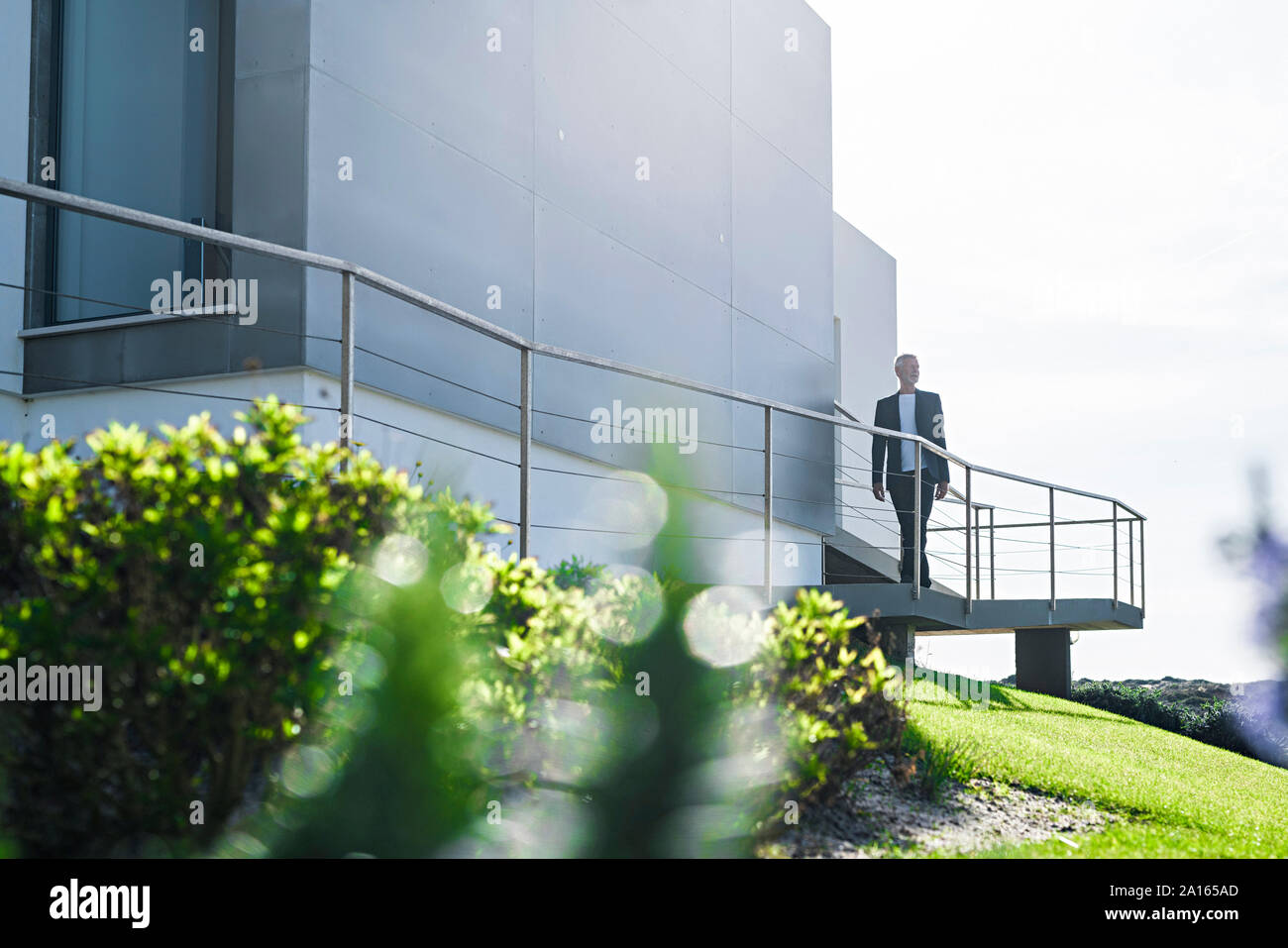Man walking into a building hi-res stock photography and images - Alamy