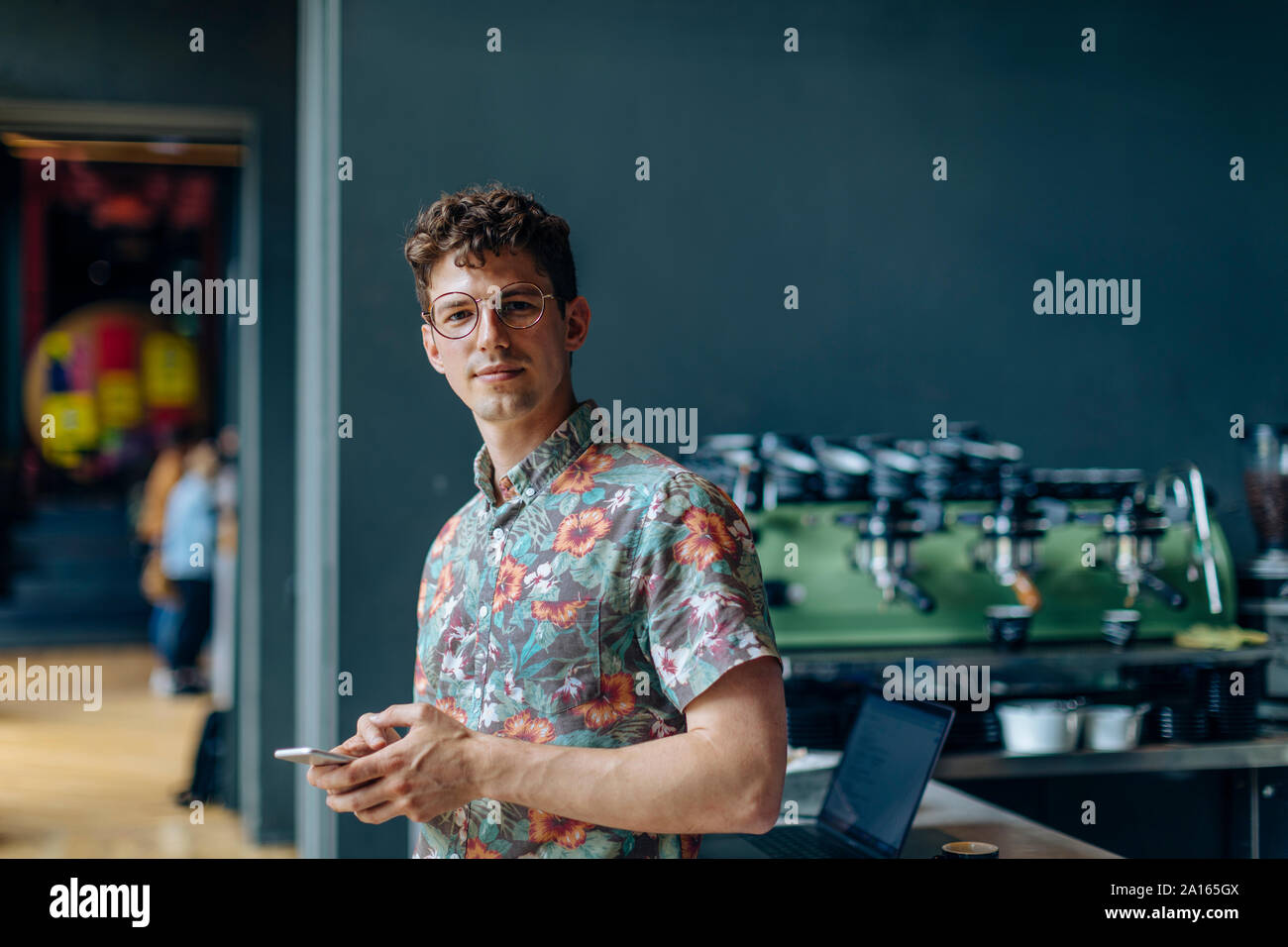 Young man using camera in hi-res stock photography and images - Alamy