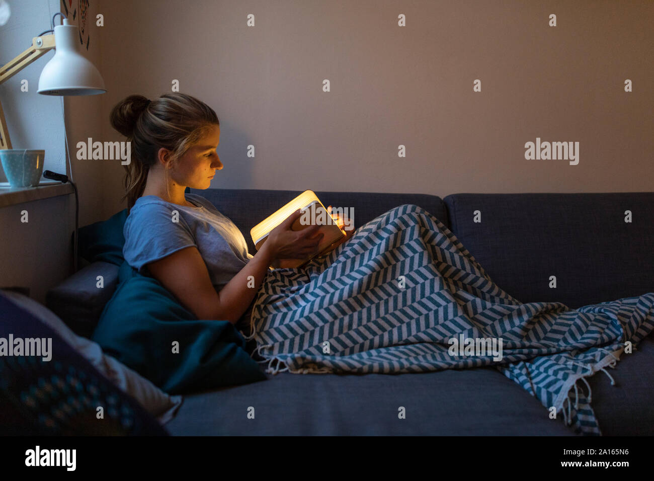 Serious woman reading book hi-res stock photography and images - Alamy