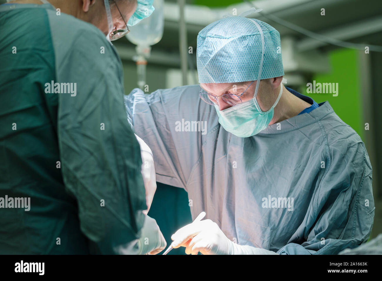 Surgeon during surgery Stock Photo - Alamy
