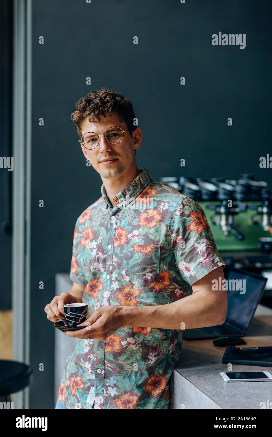 Man standing in cafe hi-res stock photography and images - Alamy