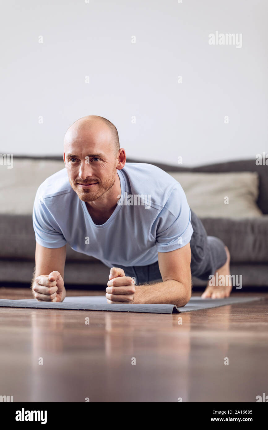 Man doing gymnastics at home Stock Photo - Alamy