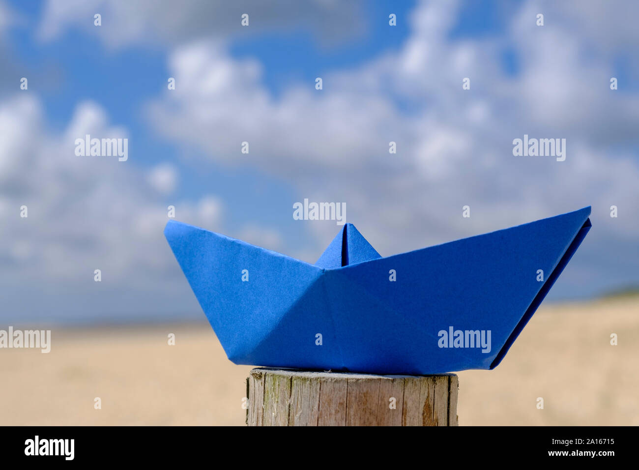 Blue paper boat Stock Photo - Alamy