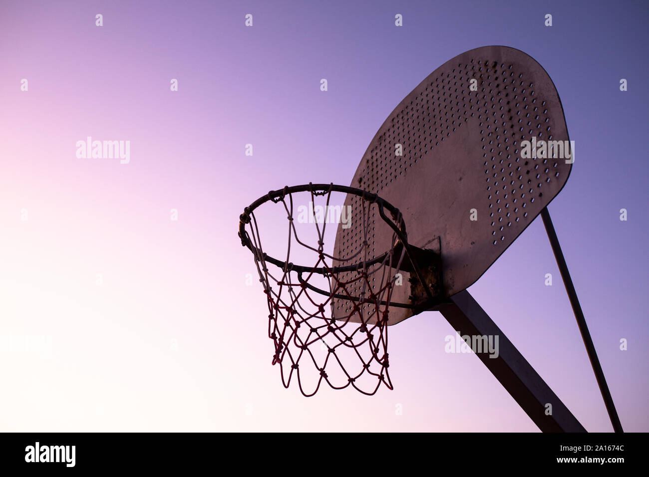 Basketball hoop at sunset Stock Photo - Alamy