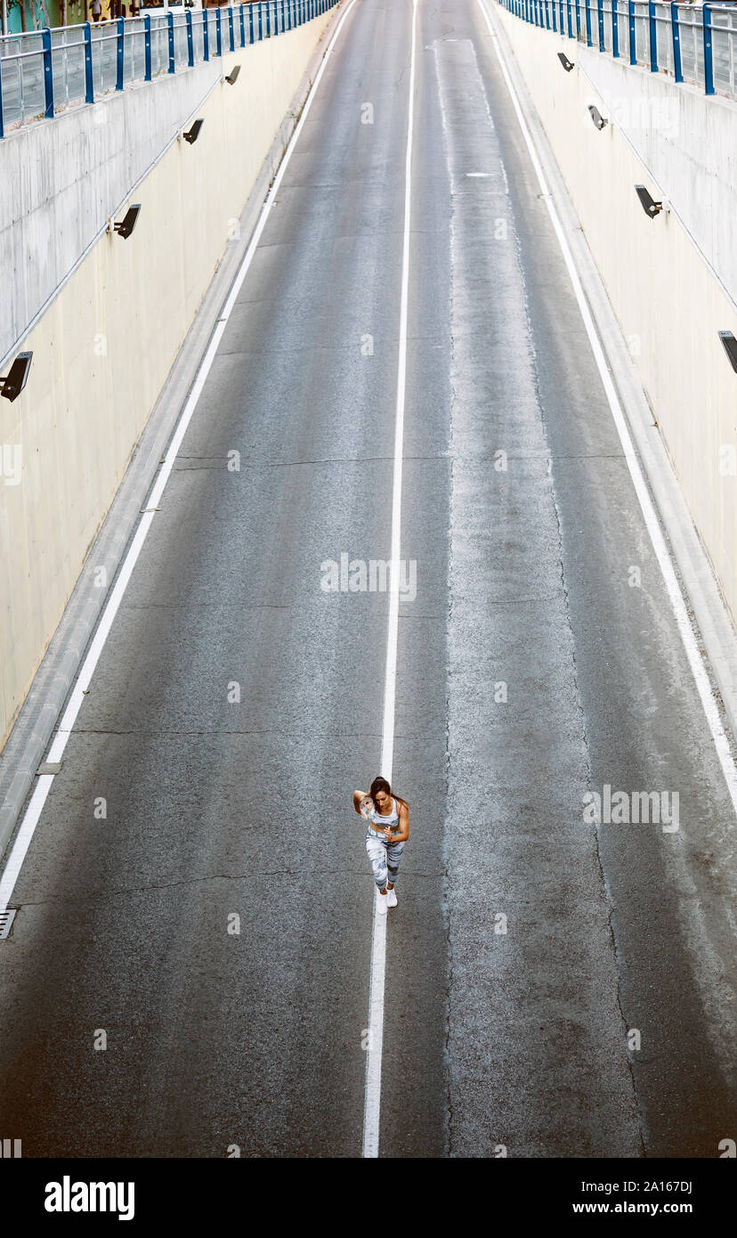 Top view of sporty young woman running on a street Stock Photo - Alamy
